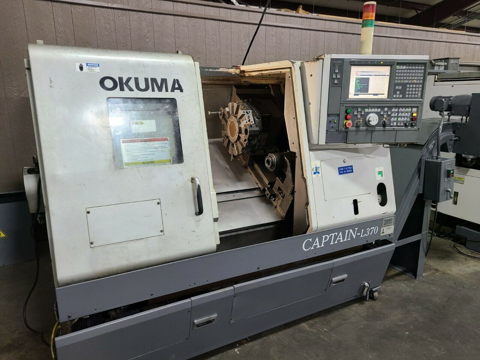 Okuma Captain L370-BB CNC Lathe w/ Chip Conveyor - The Equipment Hub